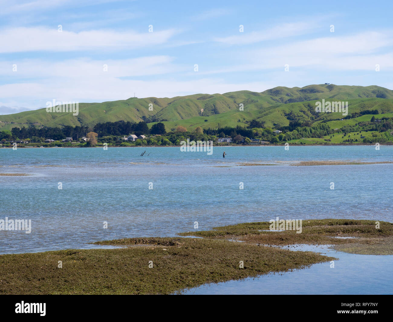 Scenic view across the tidal waters of Pauatahanui Inlet towards ...