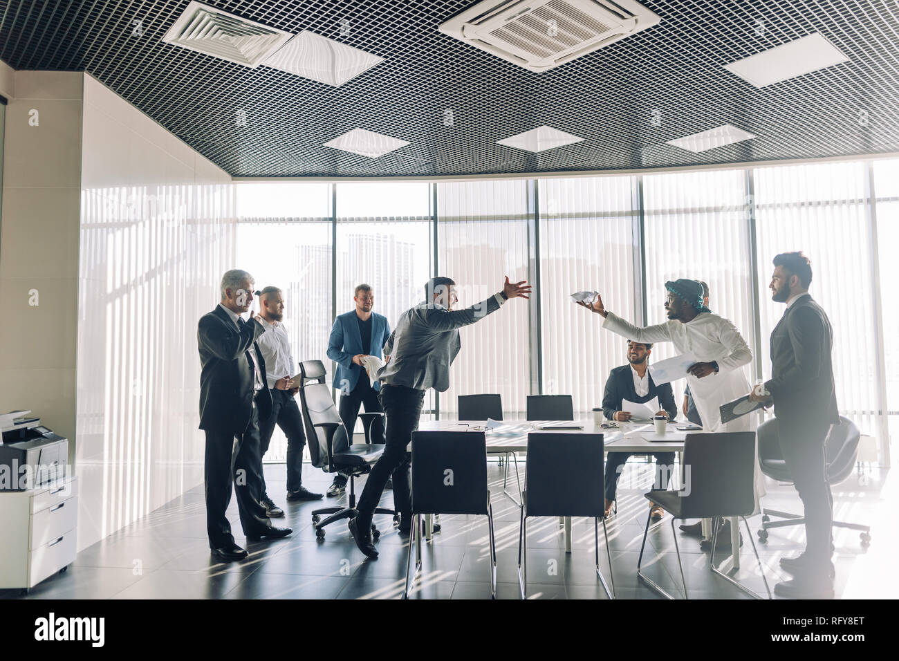 Multiracial partners dispute at negotiations, having fun while settling ...