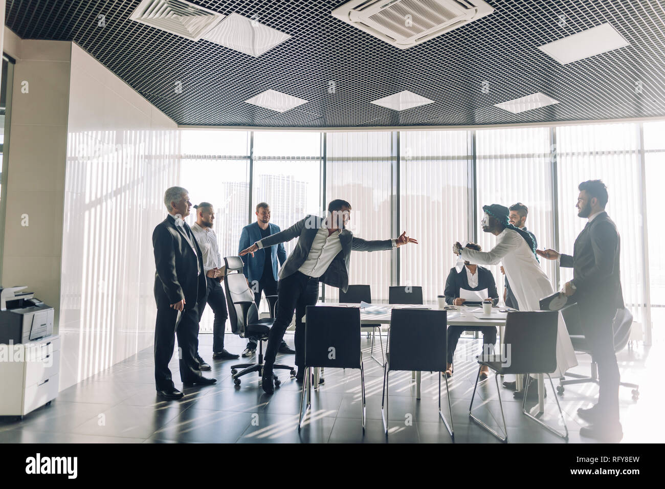 Multiracial partners dispute at negotiations, having fun while settling ...