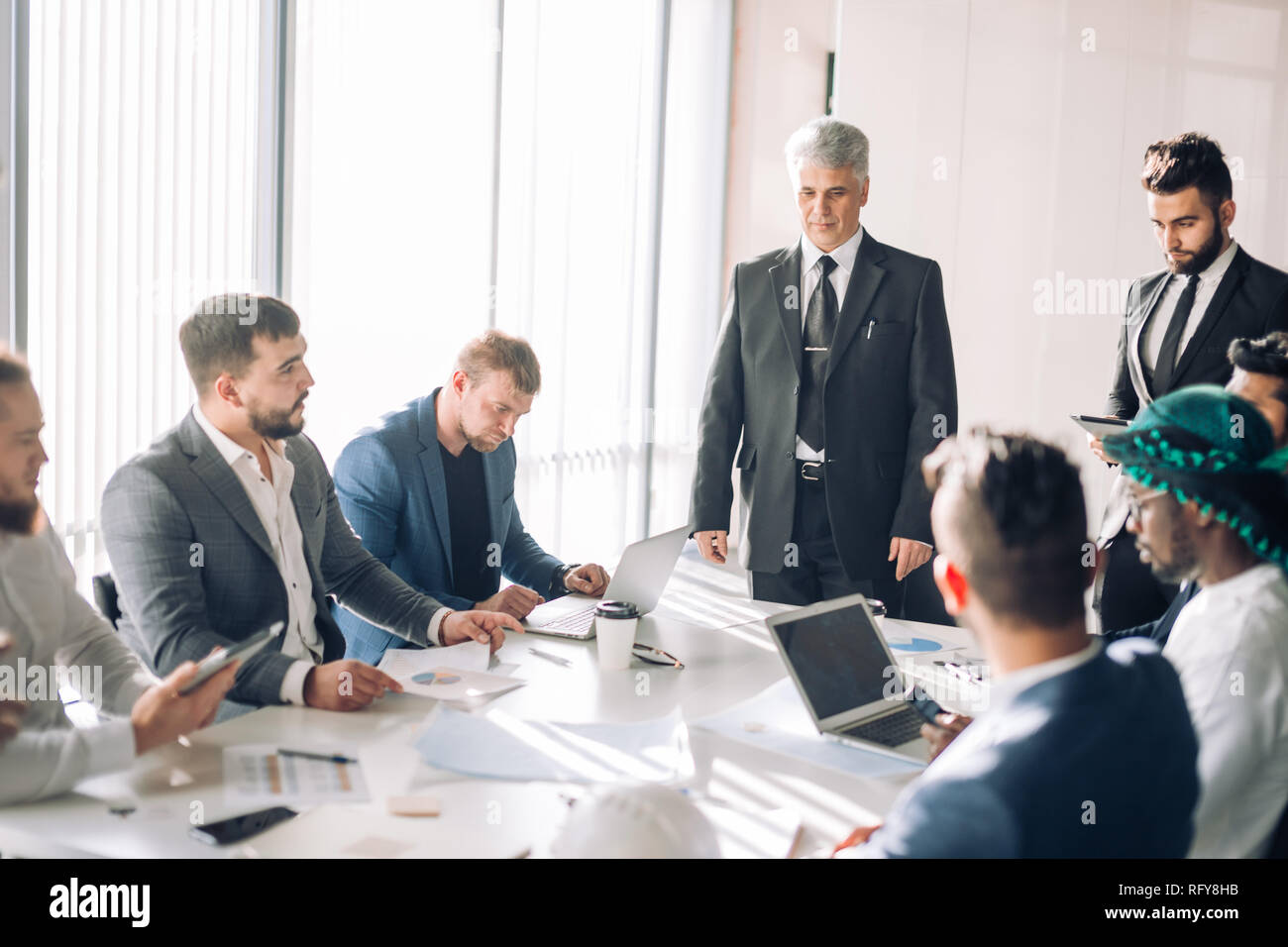 Group of business people brainstorming together in the meeting room ...