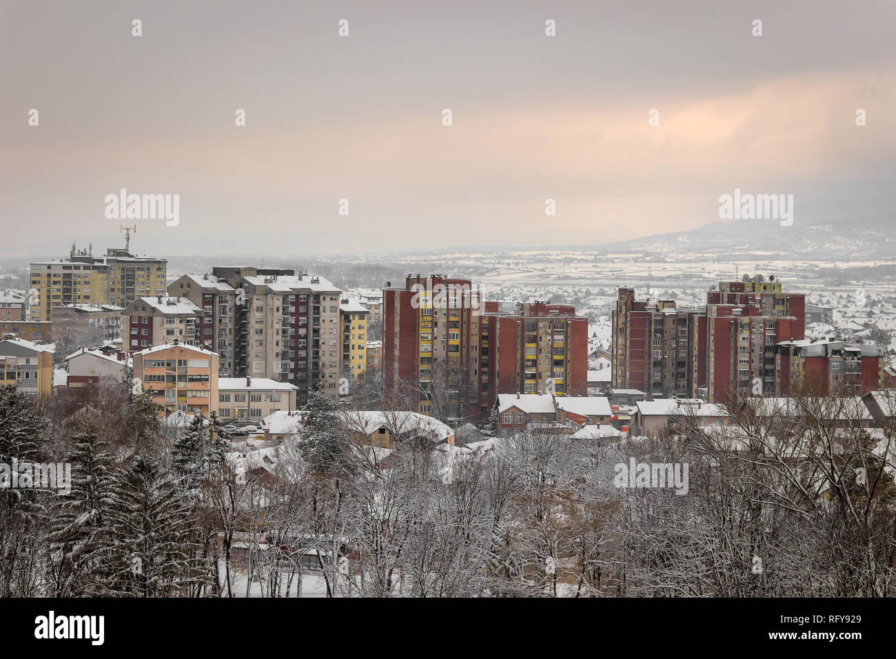 Idyllic winter cityscape, warm colors of the buildings, foreground ...