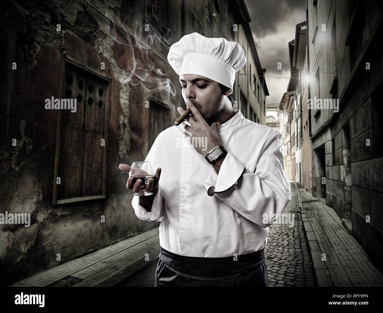 Chef with cognac and cigar smoking in dark street Stock Photo - Alamy