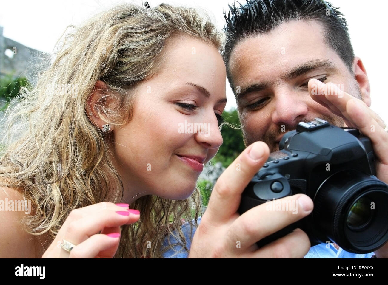 Photographer and model checking photos on camera Stock Photo - Alamy