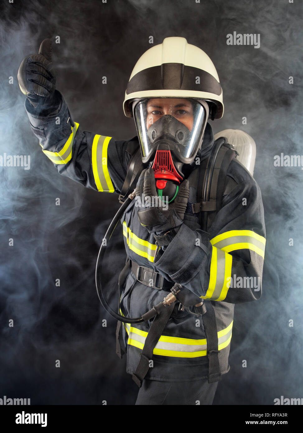 Firefighter with mask and helmet hi-res stock photography and images ...