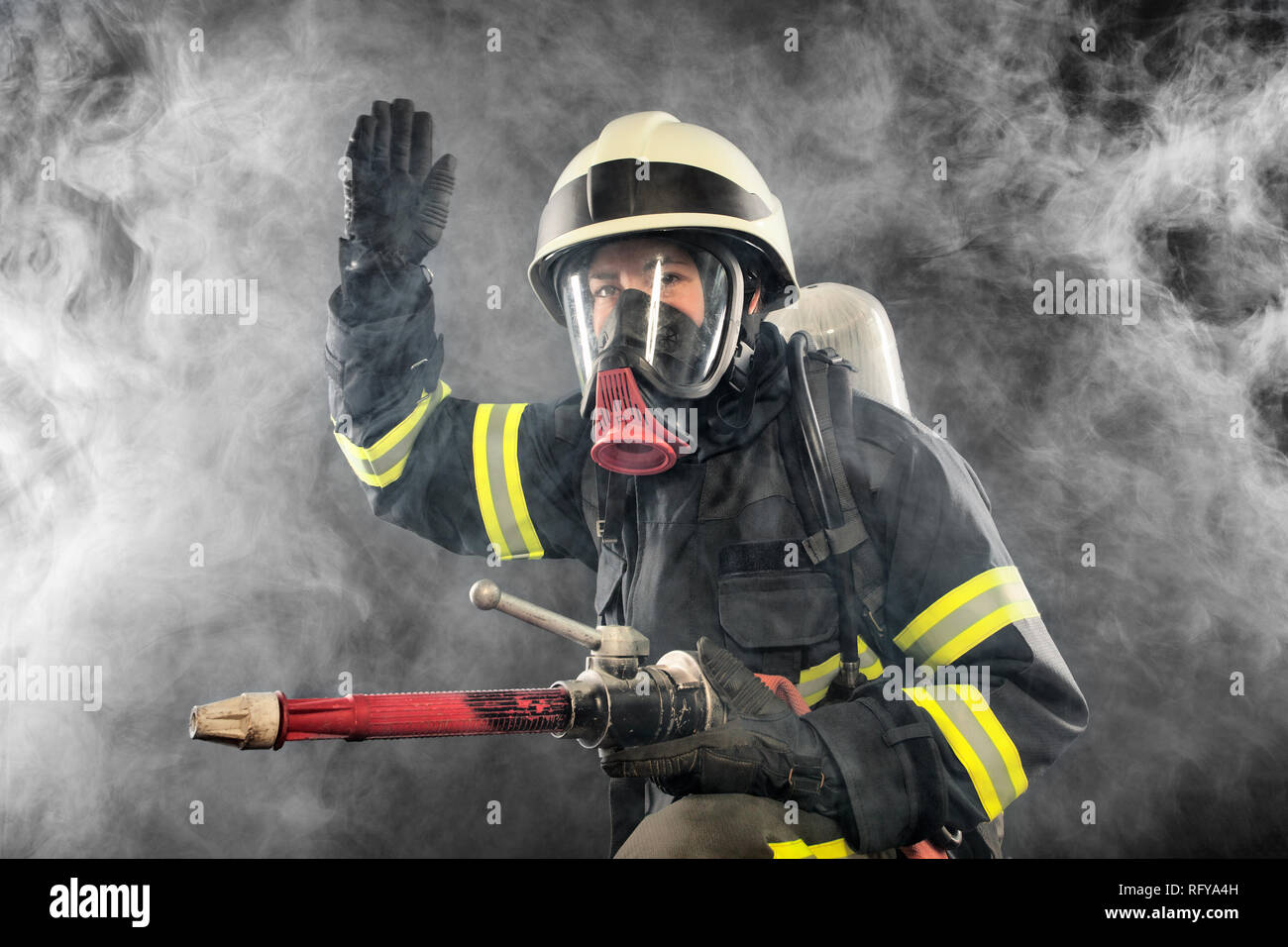 Firefighter giving directions in burning place Stock Photo - Alamy