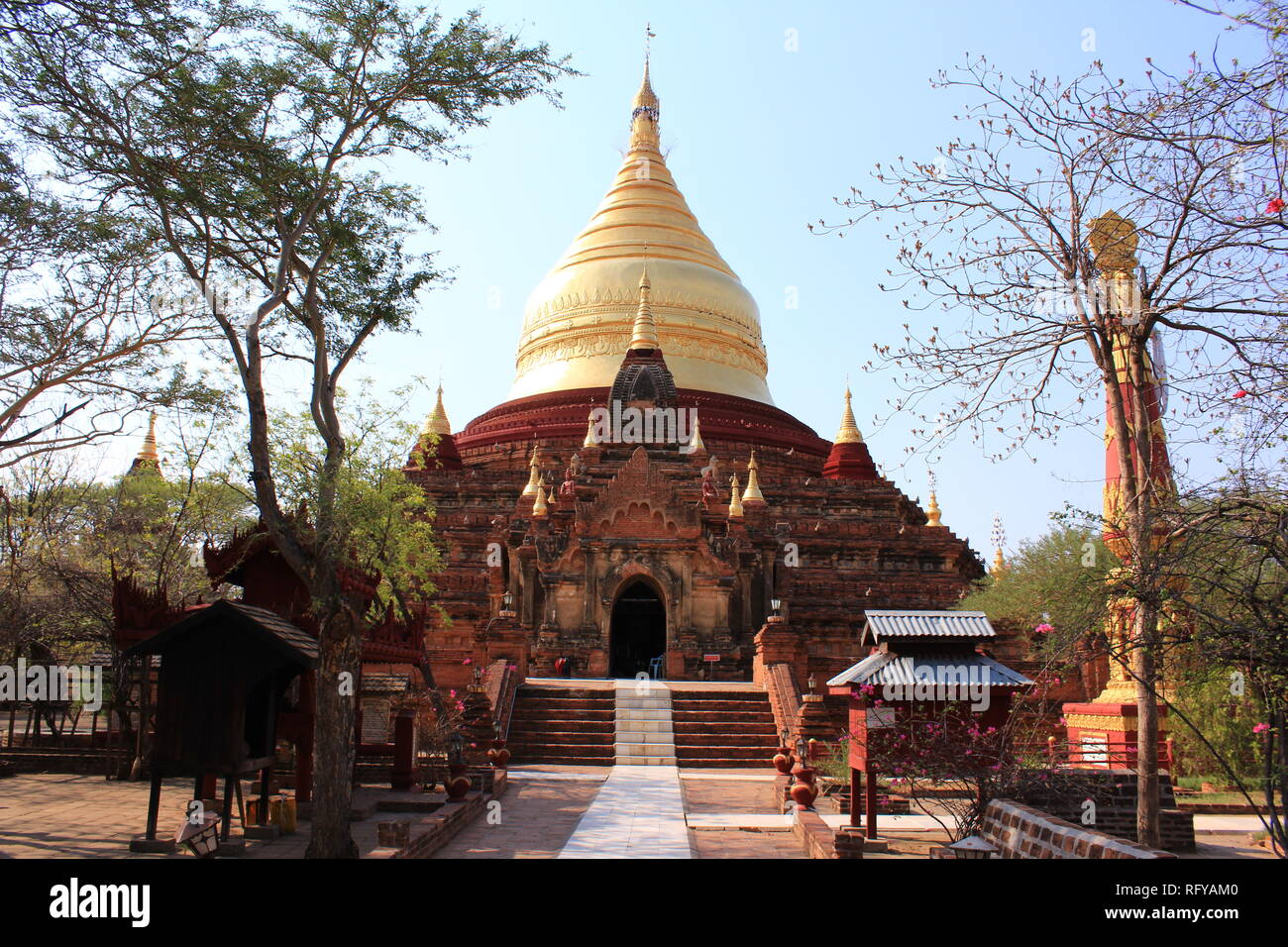 Temple with golden dome on a hot and sunny day in Bagan, Myanmar Stock ...