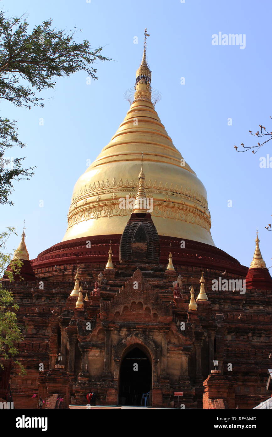 Temple with golden dome on a hot and sunny day in Bagan, Myanmar Stock ...