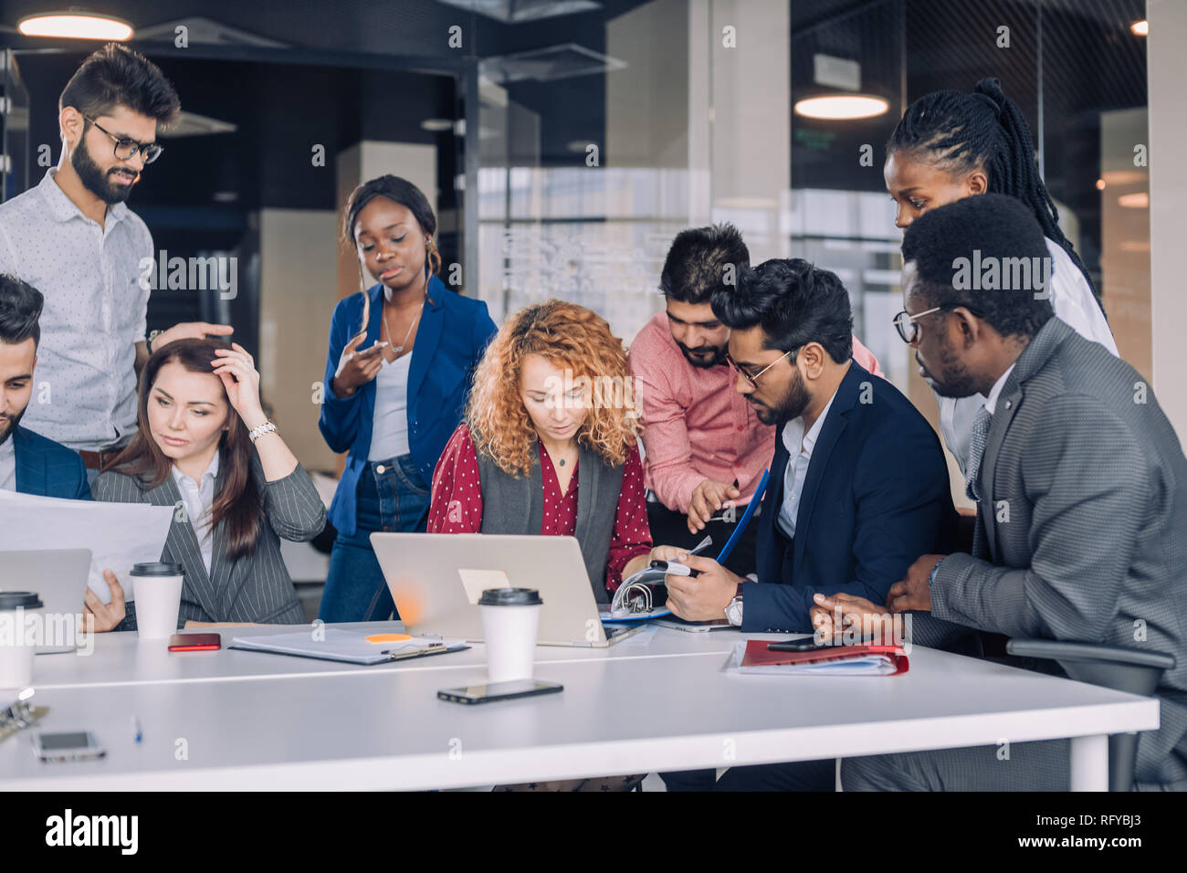 Young gathered around computer hi-res stock photography and images - Alamy