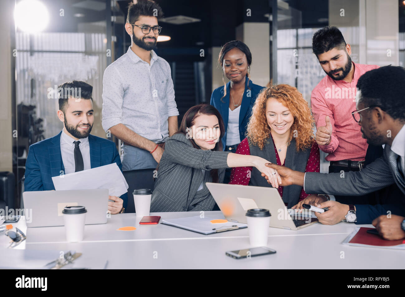 Young gathered around computer hi-res stock photography and images - Alamy