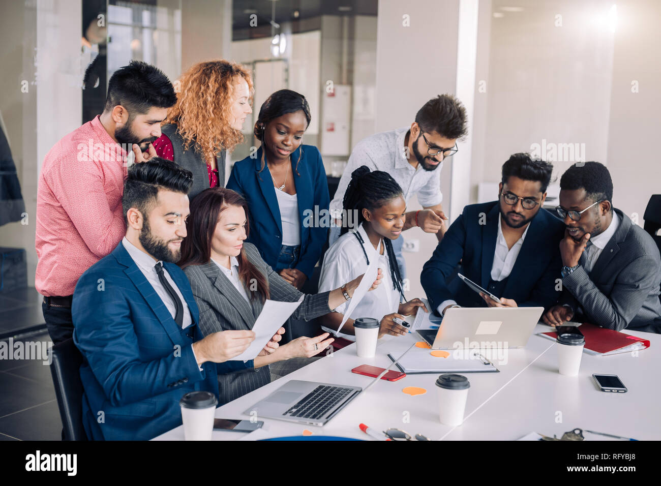 Group multiracial coworkers gathering hi-res stock photography and ...