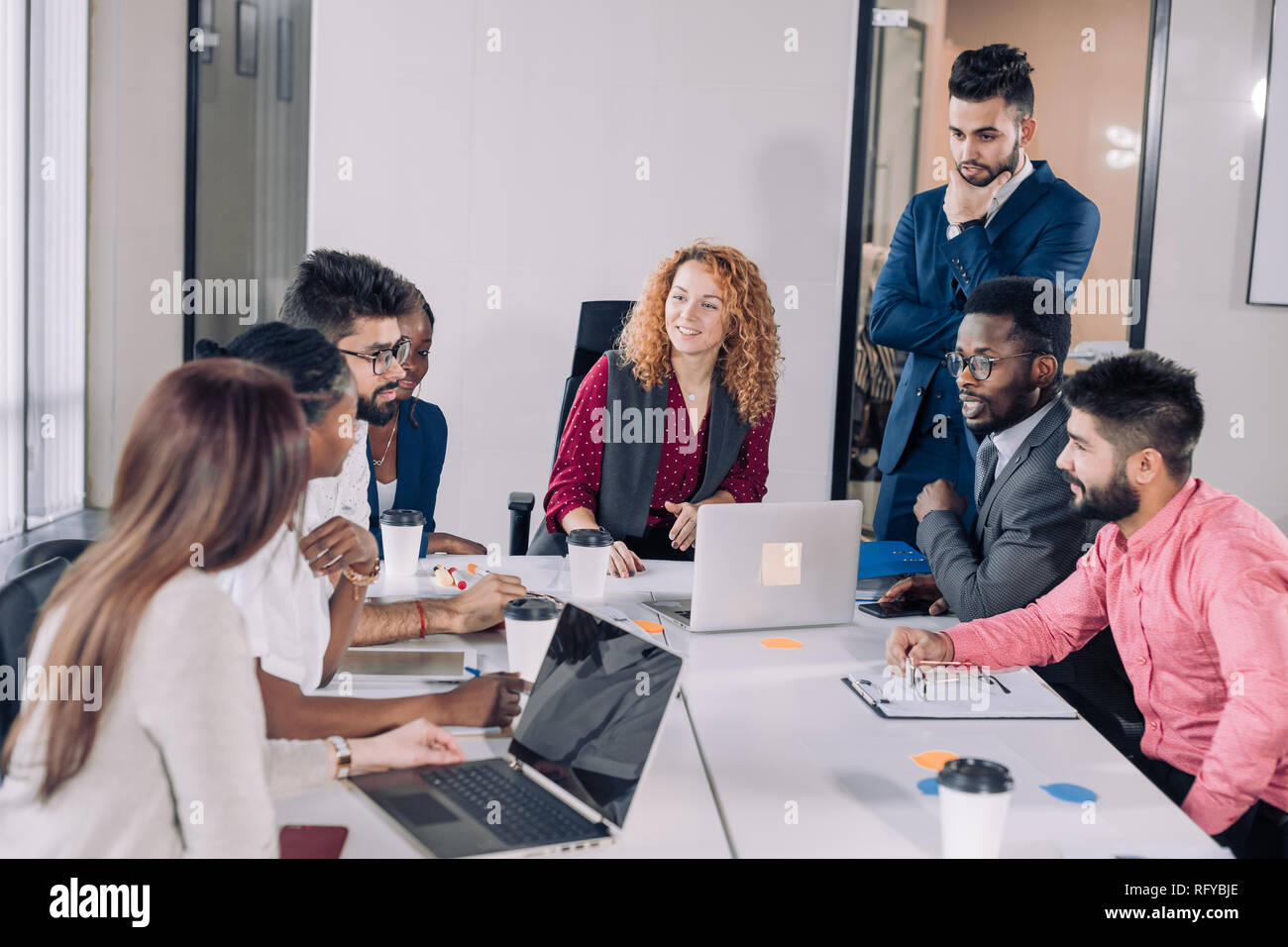 Business colleagues in conference meeting room during presentation ...