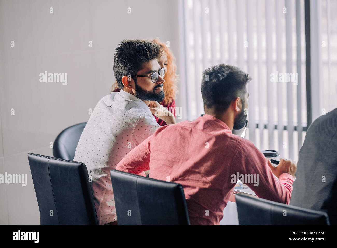 Row of unrecognizable business people sit in conference hall at ...