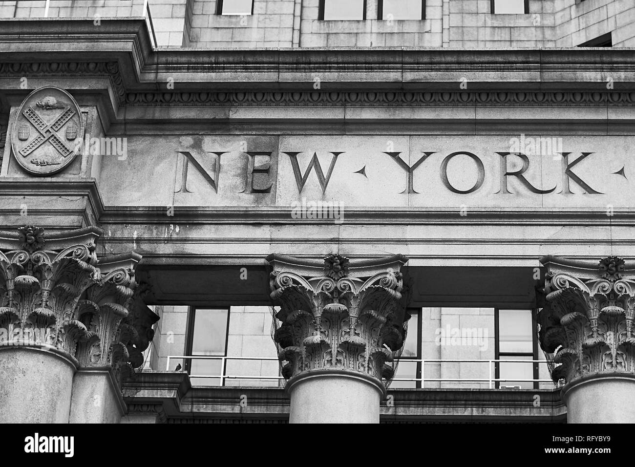 Word New York engraved on the old building facade in NYC, USA Stock ...