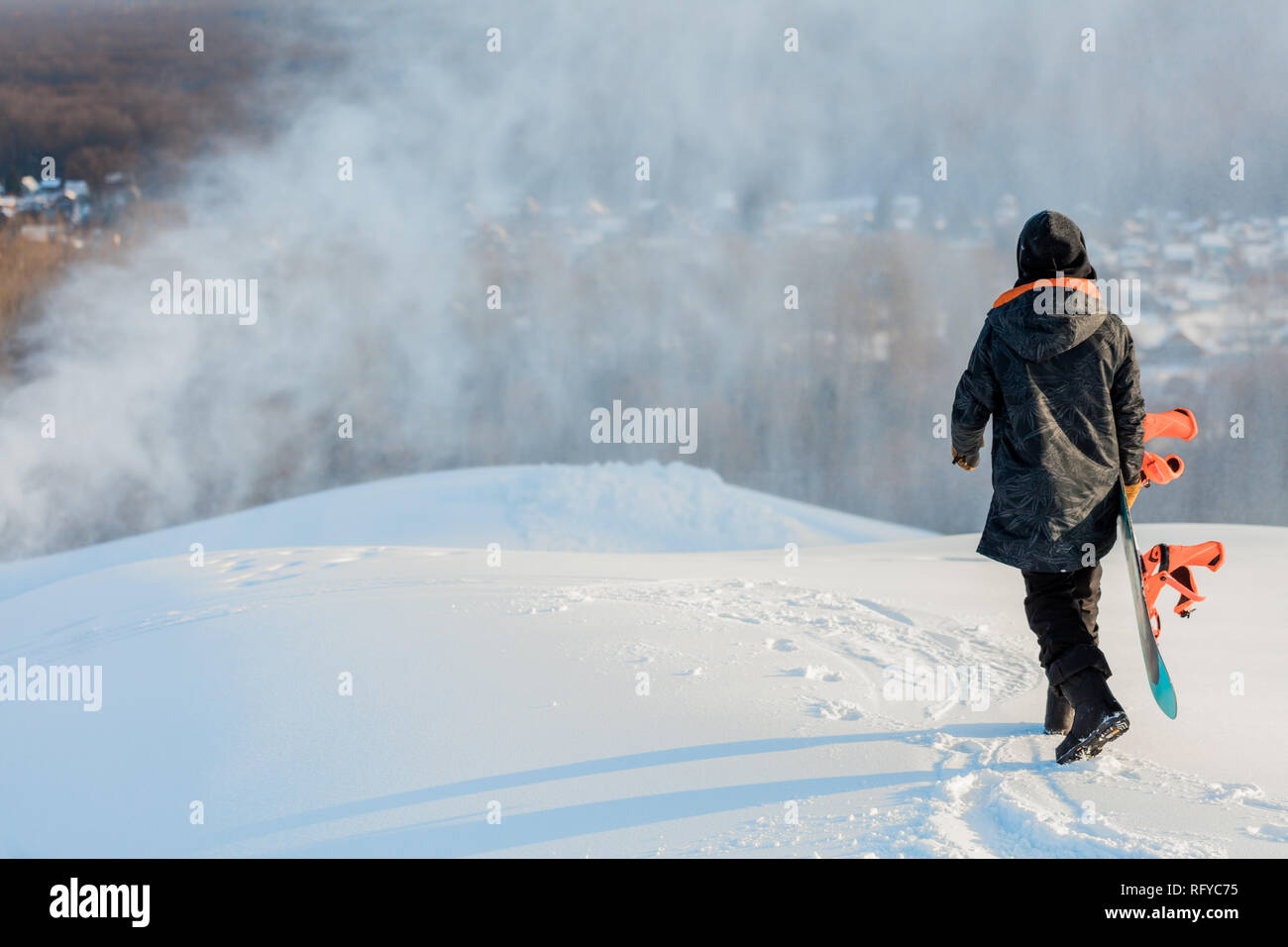back view photo. athlete is carring a sports equipment Stock Photo - Alamy