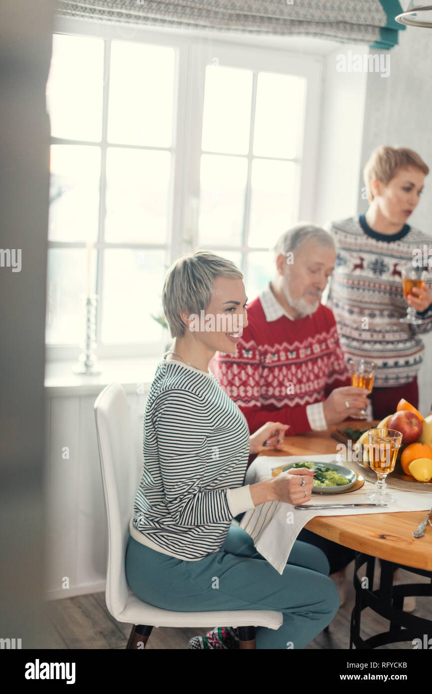 awesome charming blond girl having supper with family Stock Photo - Alamy
