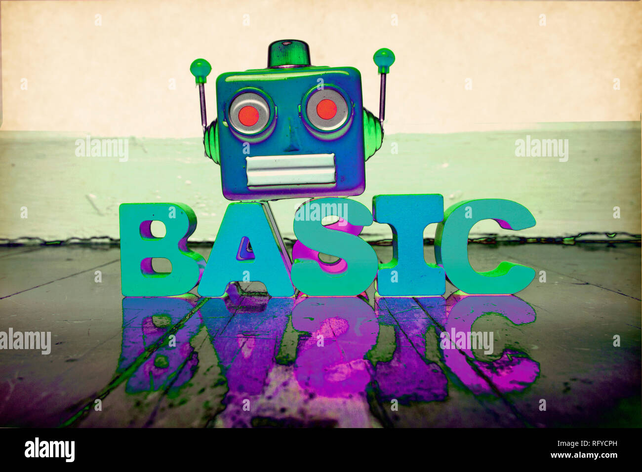 robot head and the word BASIC on a old wooden floor solarized color ...
