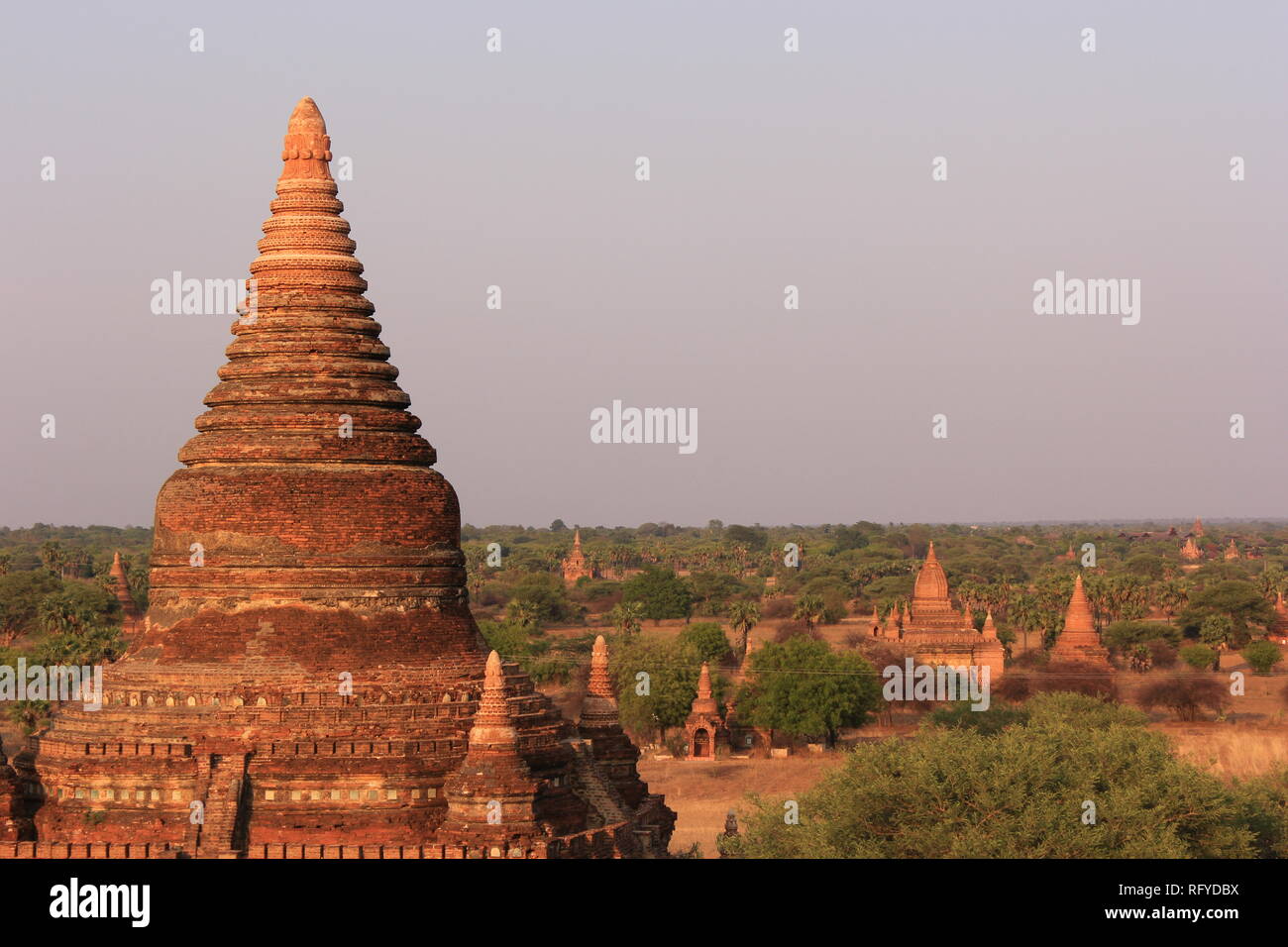 Temple landscape of dry Bagan in Myanmar with green bushes Stock Photo ...