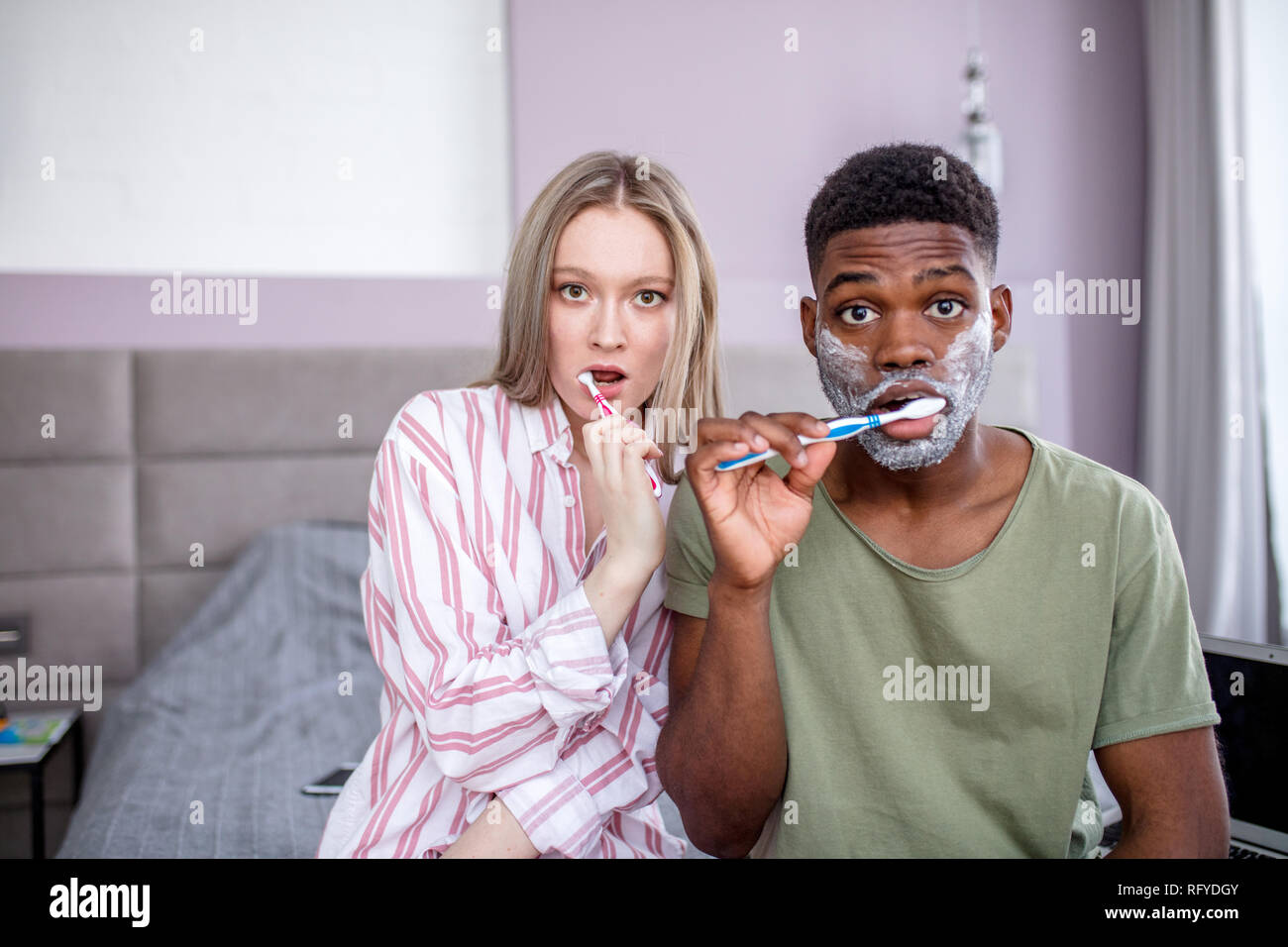 Couple washing teeth in morning, dental hygiene is important Stock ...