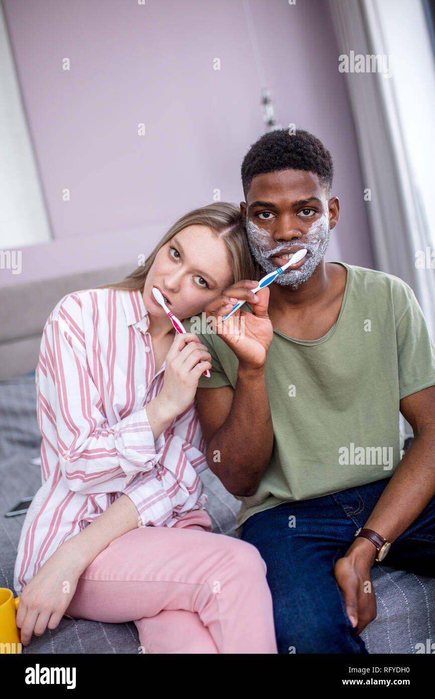 Couple washing teeth in morning, dental hygiene is important Stock ...