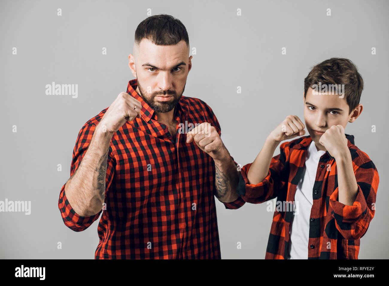 young awesome daddy teaching his son to fight Stock Photo - Alamy