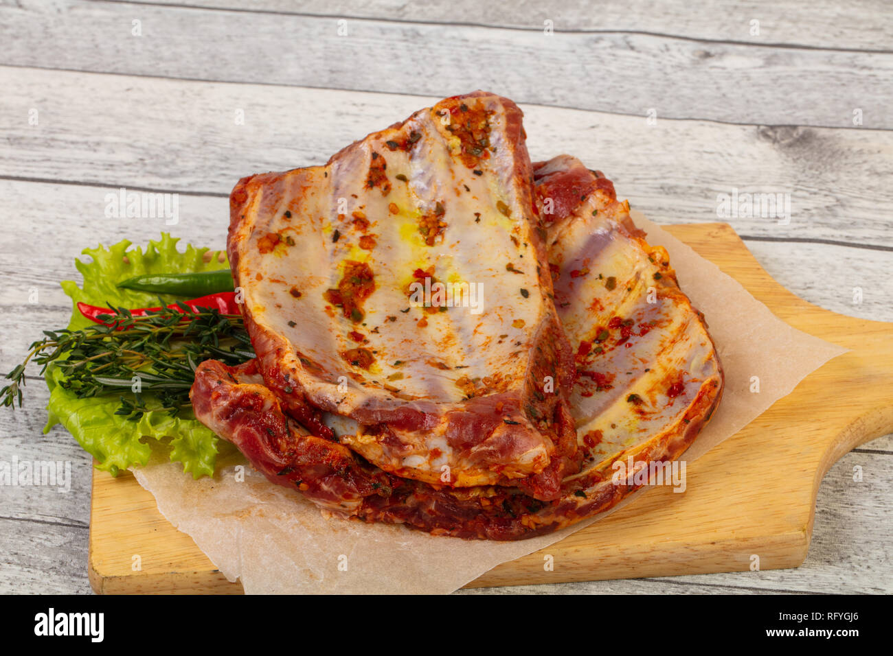 Marinated Raw pork ribs for grill Stock Photo - Alamy
