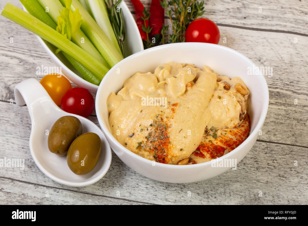 Vegan cuisine - Humus with celery sticks Stock Photo - Alamy