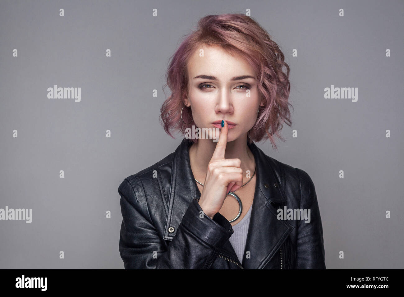 Portrait of serious beautiful girl with short hairstyle and makeup in ...