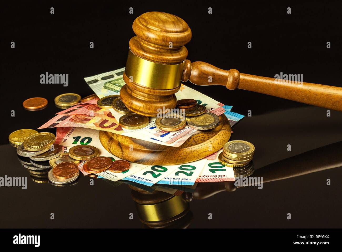 A bribe in court. Corruption in Justice. Judging hammer and euro ...