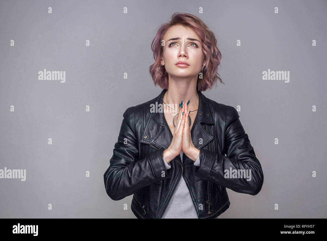 God, please forgive me. Portrait of sad prayer beautiful girl with ...