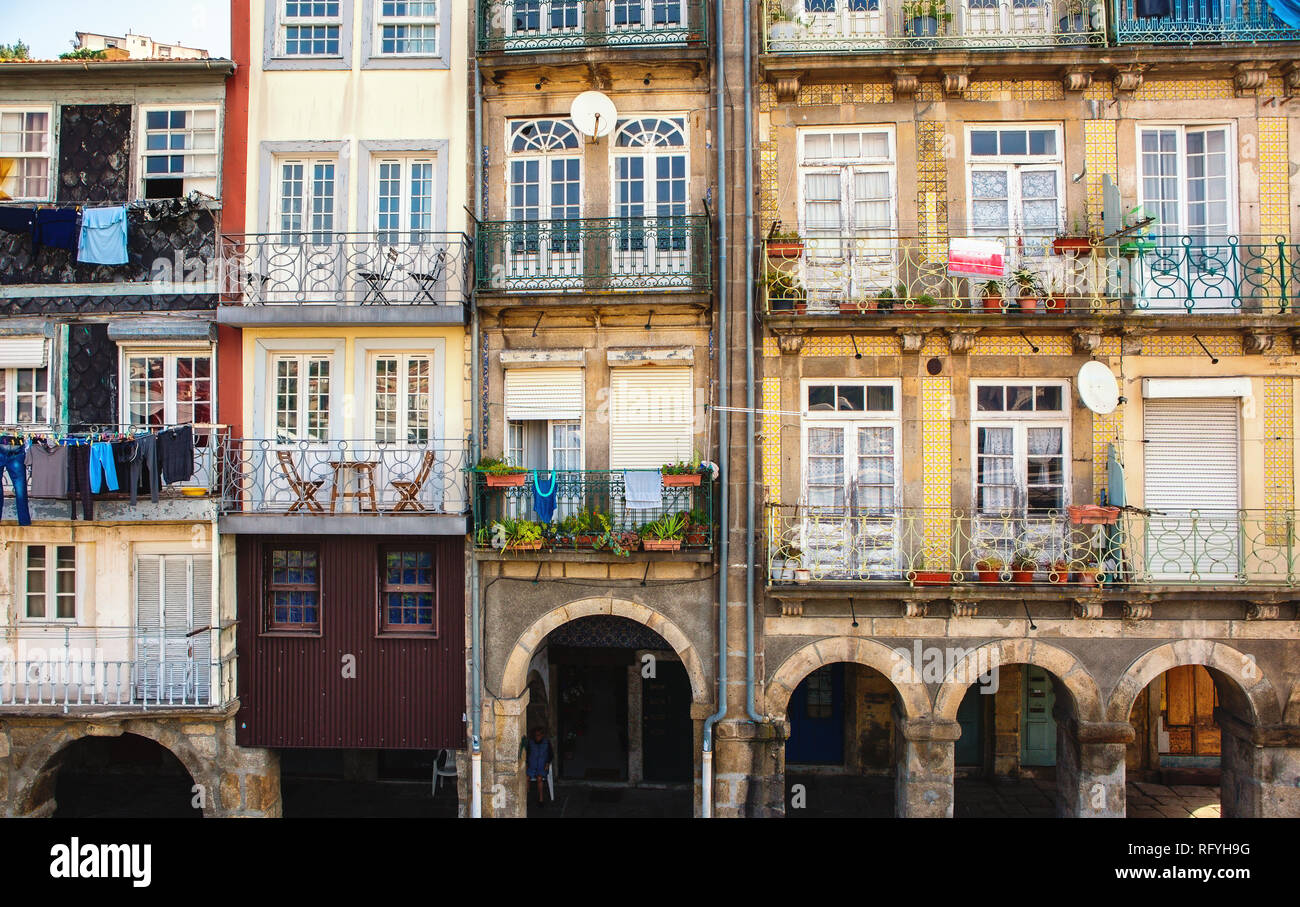 Traditional facades of houses in Ribeira district, Porto, Portugal ...