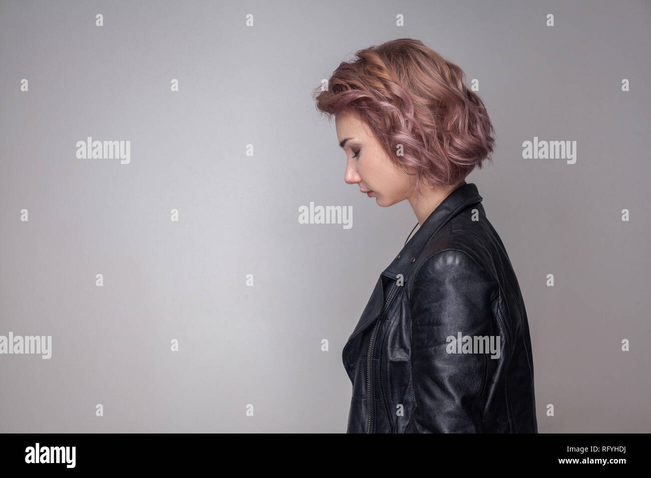 Profile side view portrait of sad depressed beautiful girl with short ...