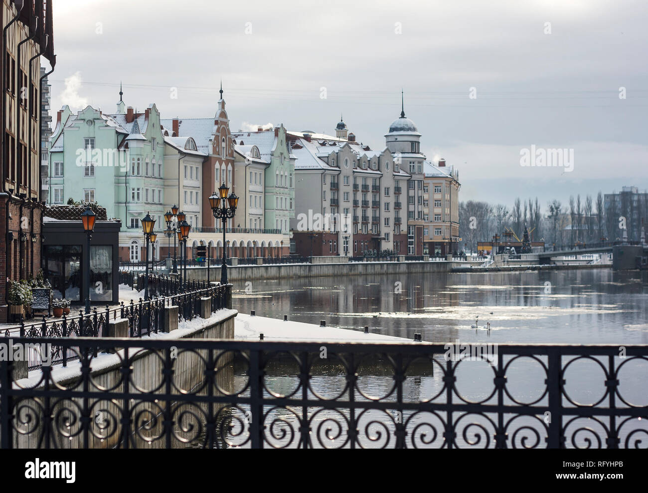 cityscape with river on gloomy winter evening Stock Photo - Alamy