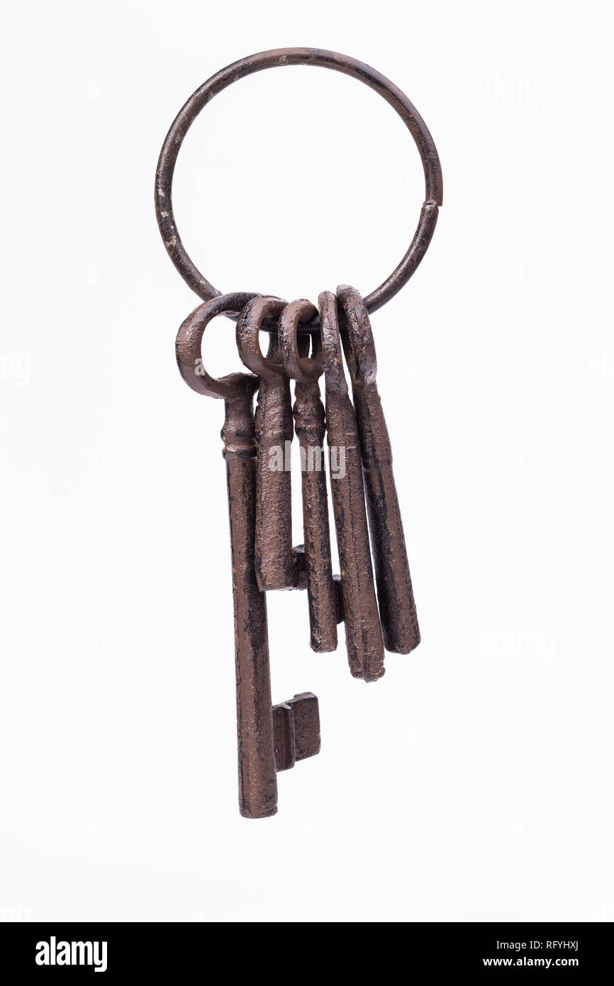 Image shows an old, rustic key ring, isolated on white Stock Photo - Alamy