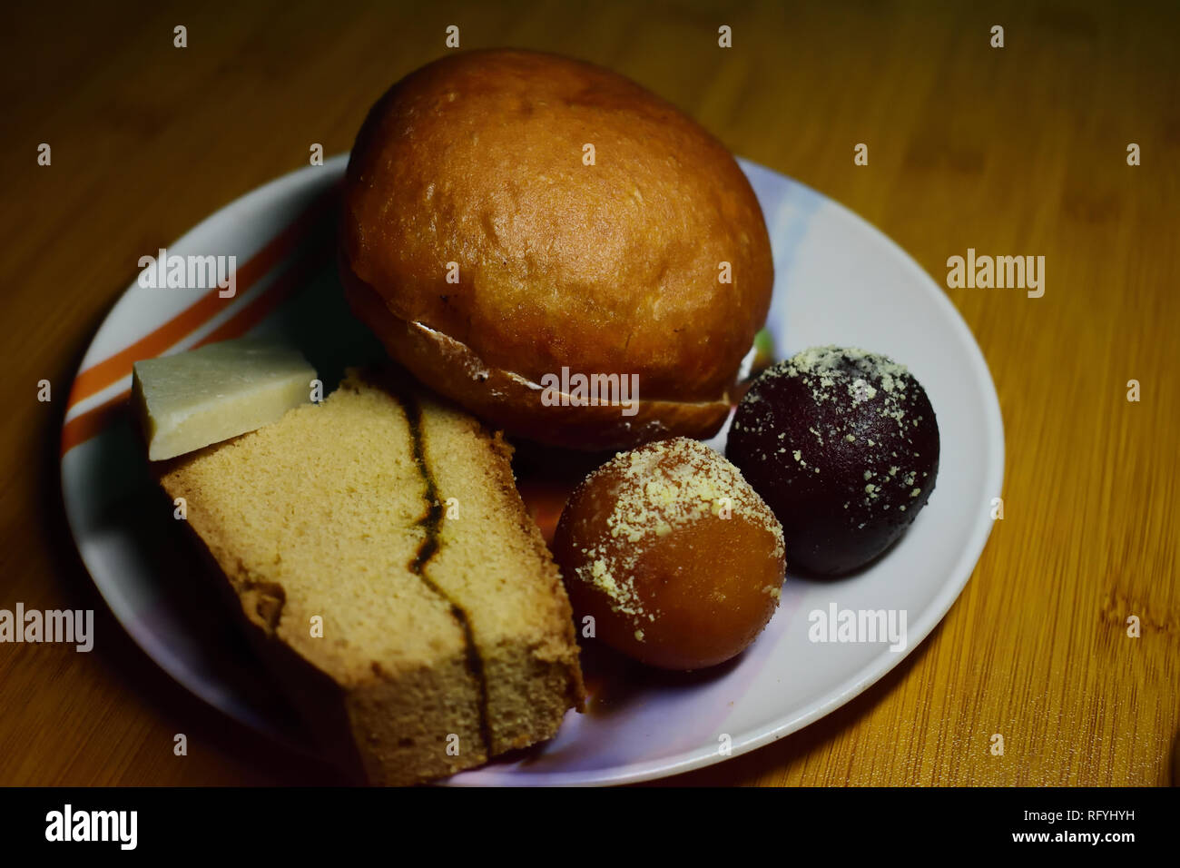 Sweets and Cake on a plate Stock Photo - Alamy