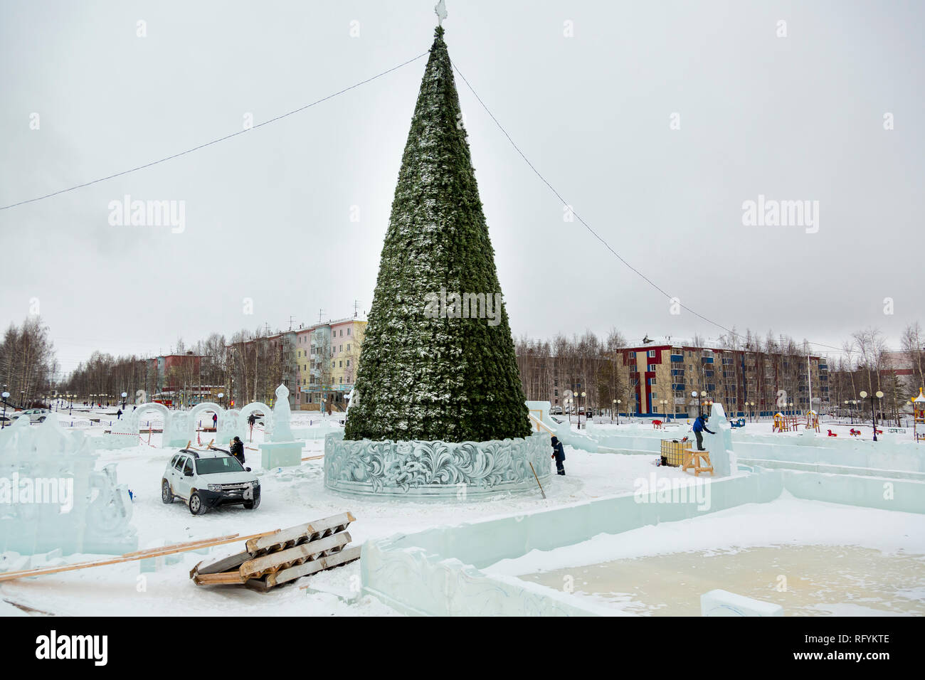Workers build an ice town for the Christmas holidays Stock Photo - Alamy