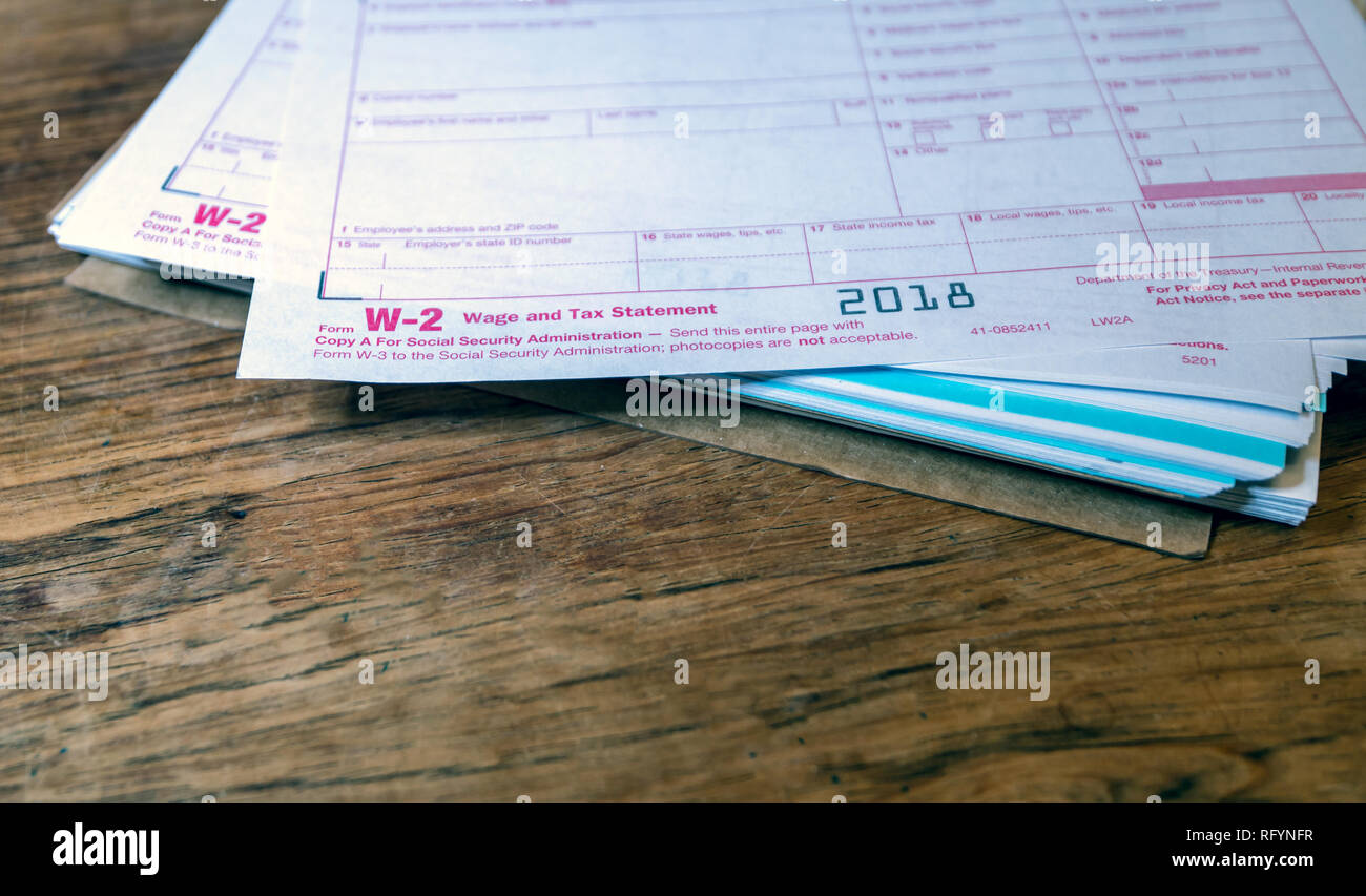 USA IRS W-4 tax forms lying on a table ready to be filled out Stock ...