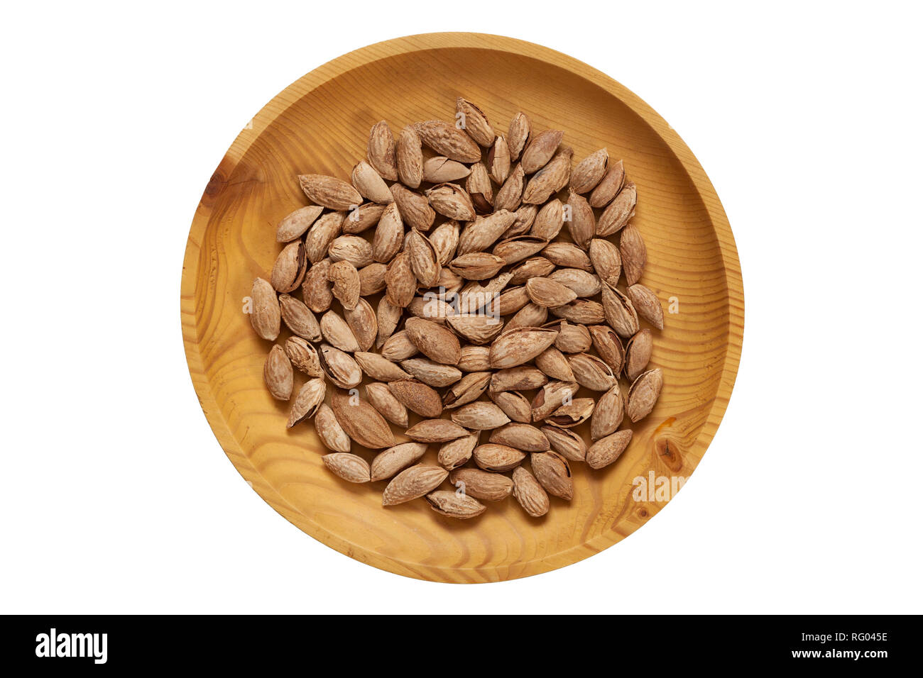Unpeeled almonds Badam in a wooden pine plate on a white isolated ...