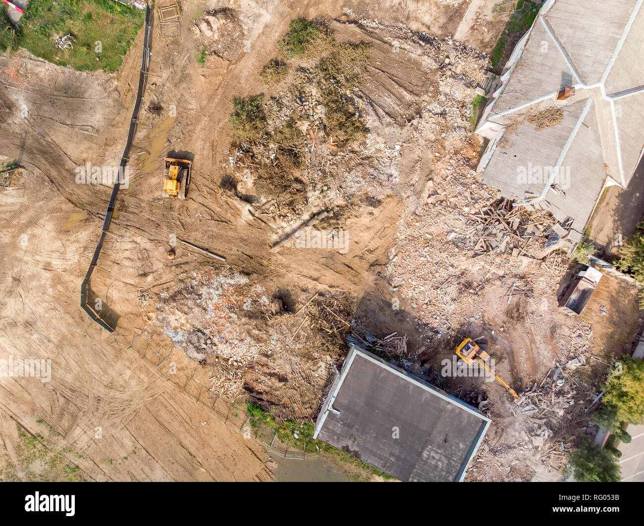 aerial top view of demolition site with heavy construction machinery ...