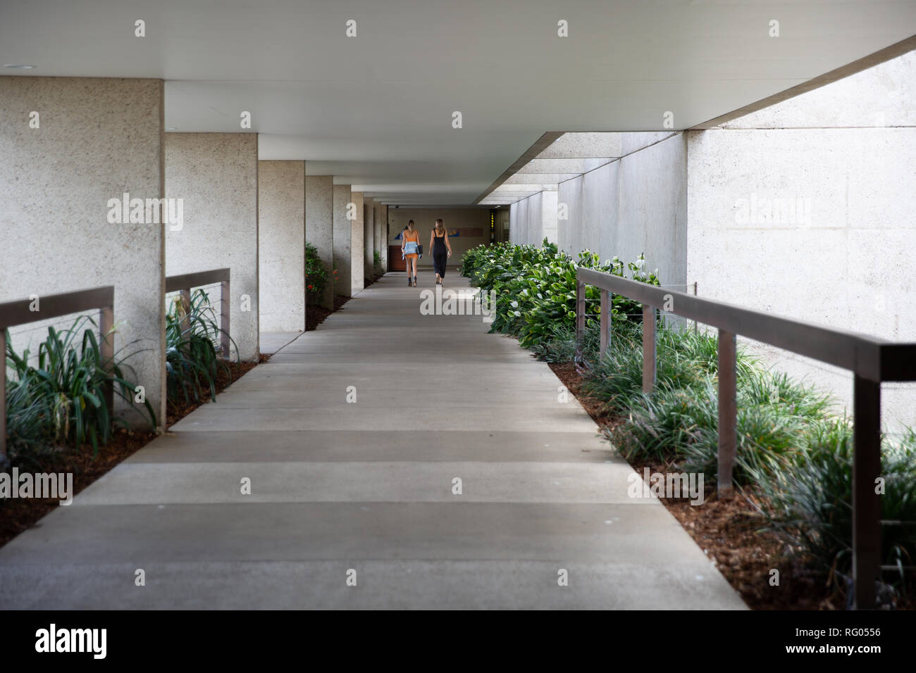 People at the end of a walkway Stock Photo - Alamy