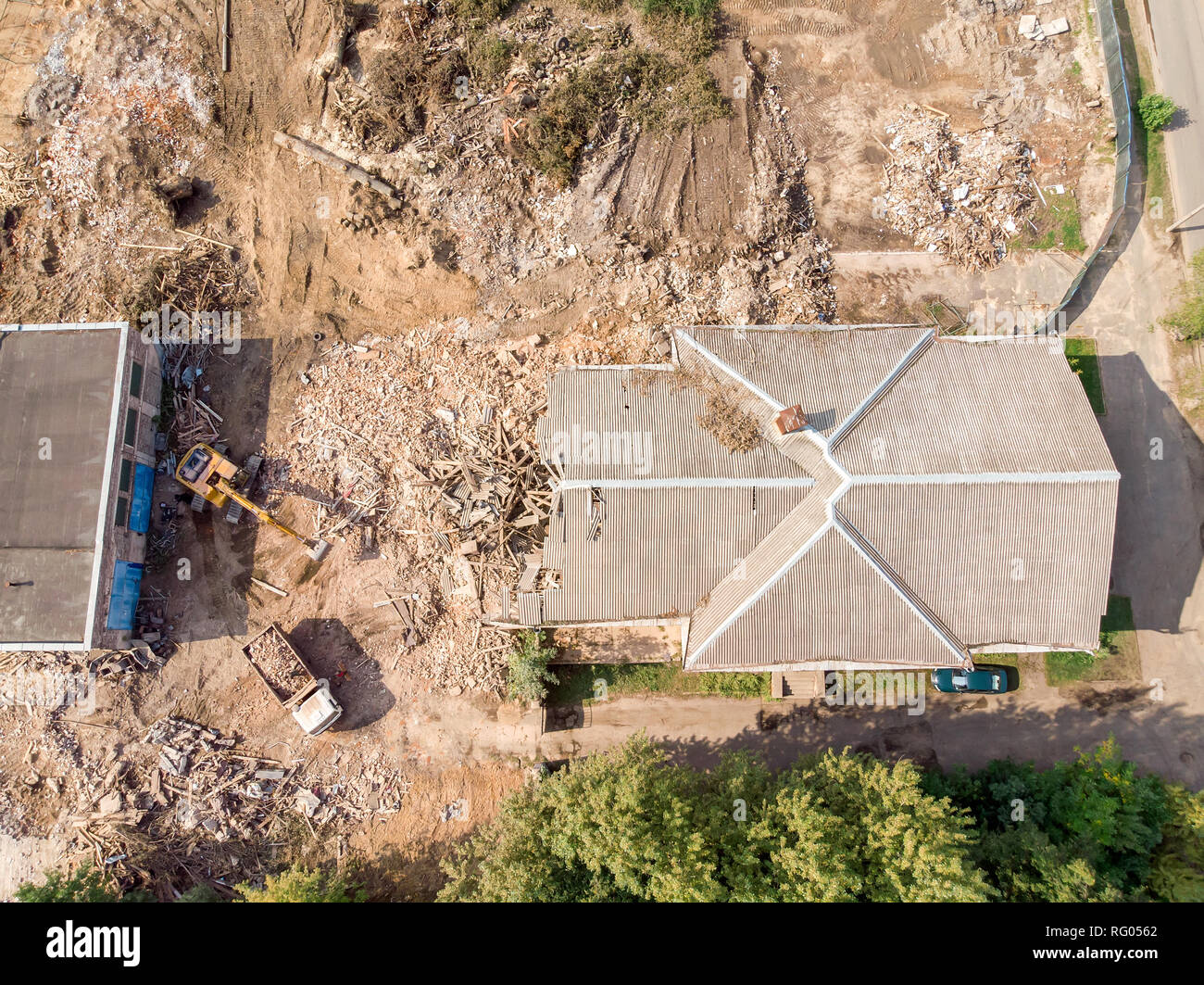 demolition site aerial top view. heavy construction machines clearing ...