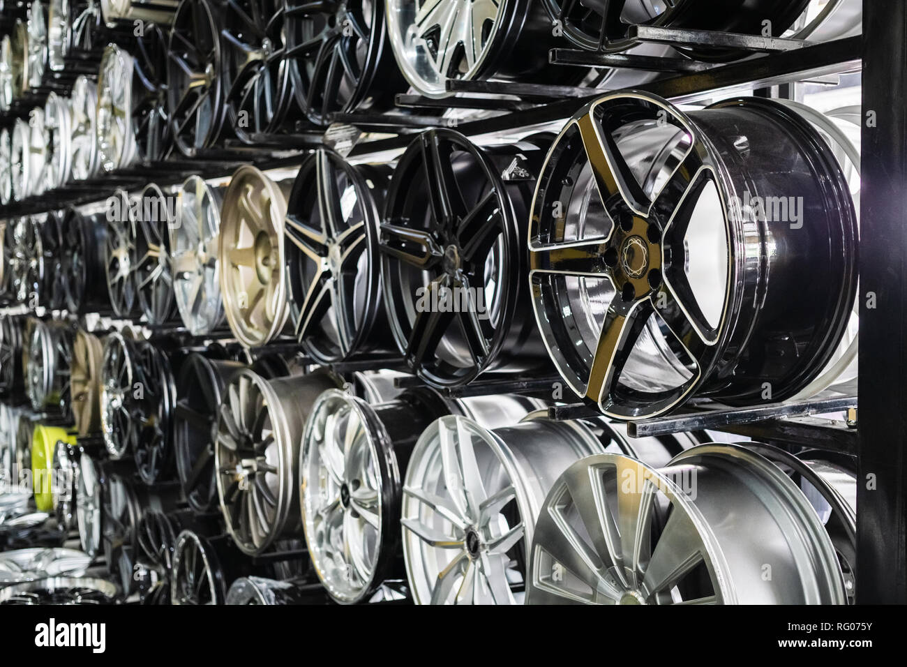 wall of alloy car wheels in store Stock Photo - Alamy