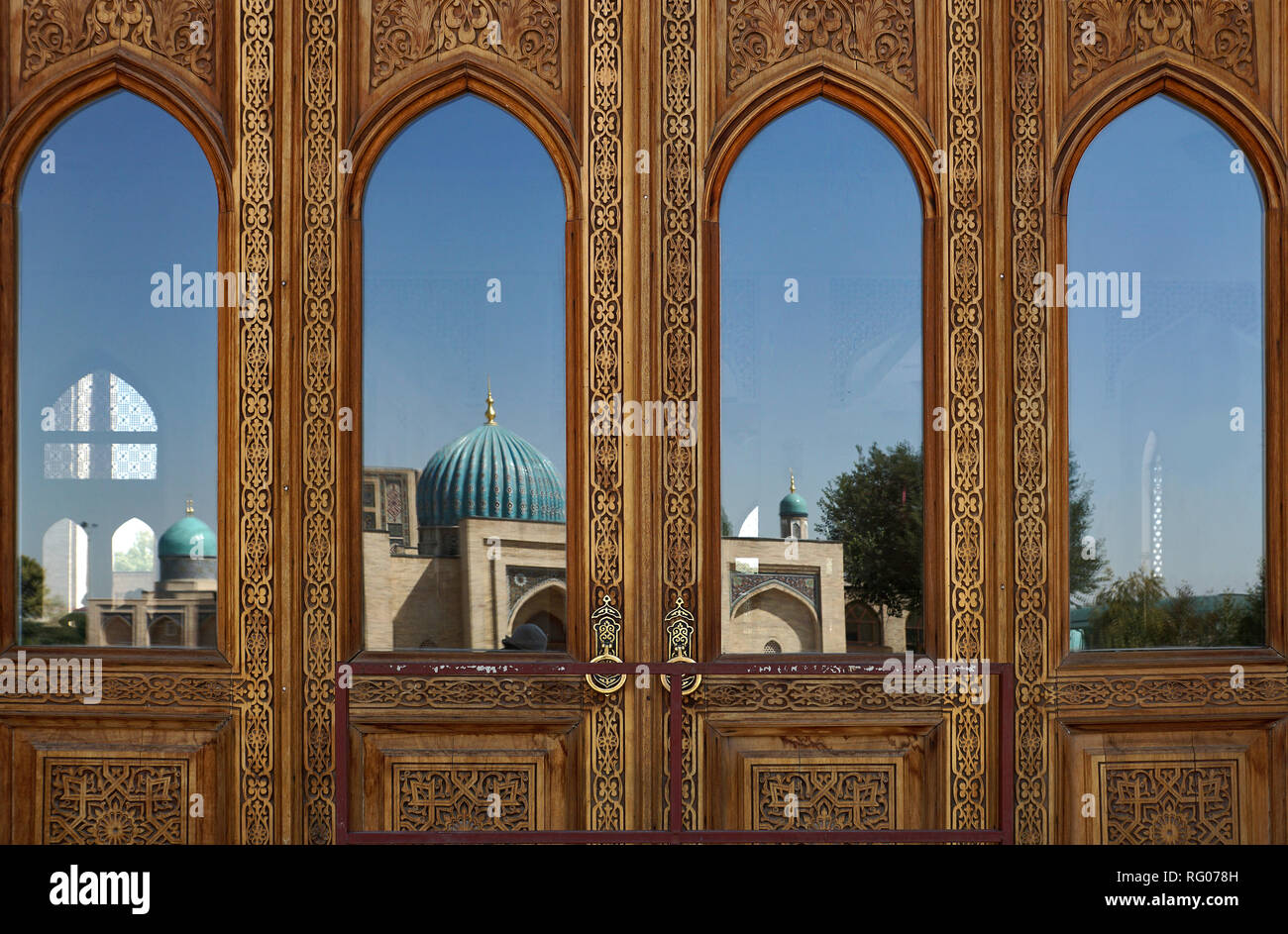 historic wooden door with glass reflecting Barak-chan mosques in ...