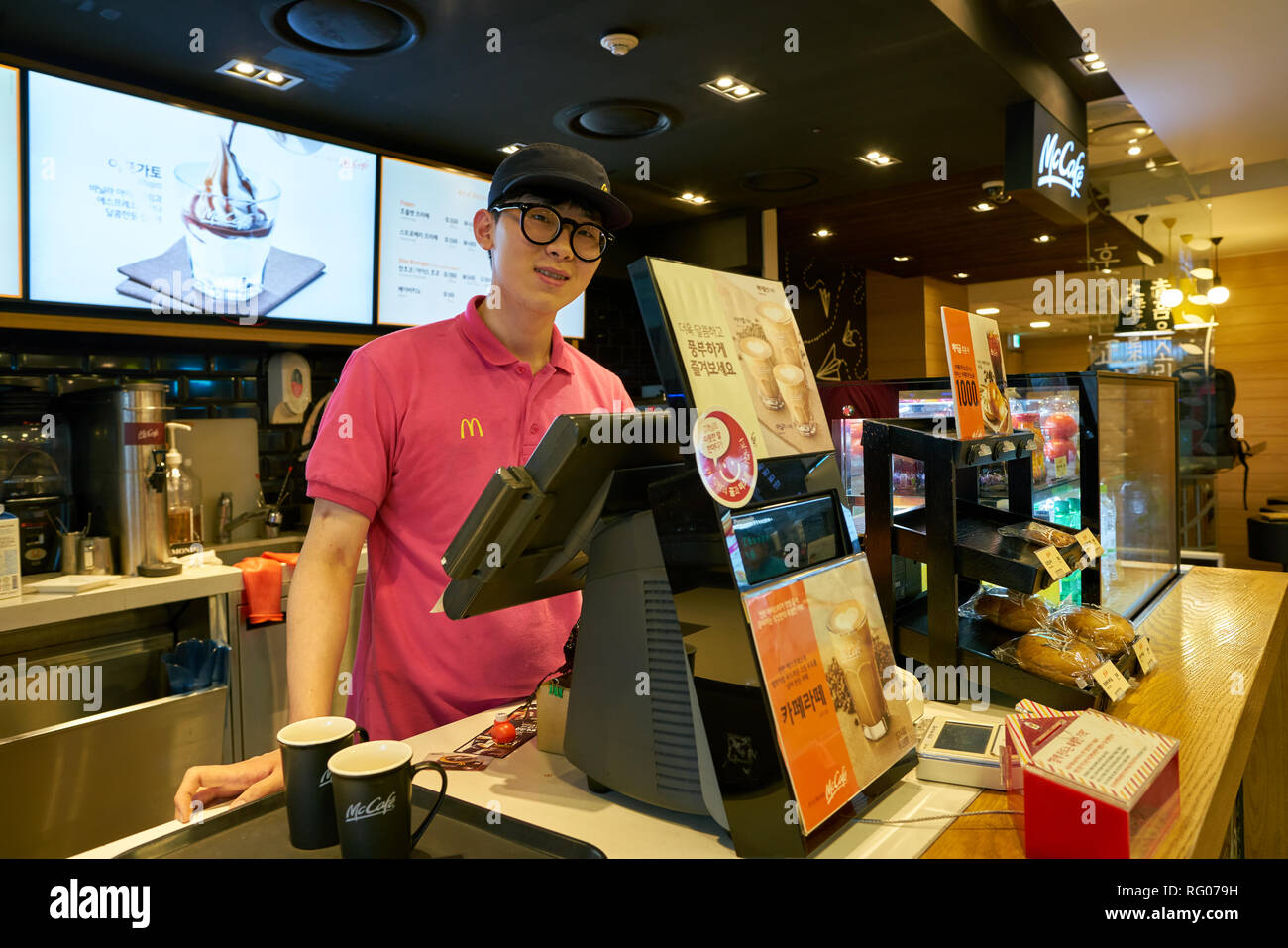 SEOUL, SOUTH KOREA - CIRCA MAY, 2017: worker at McCafe. McCafe is a ...