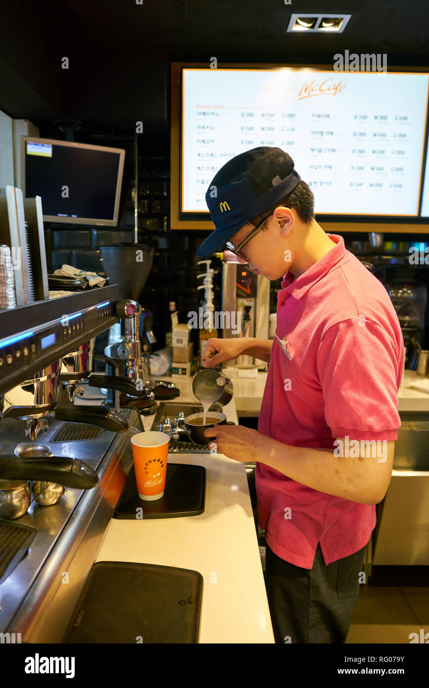 SEOUL, SOUTH KOREA - CIRCA MAY, 2017: barista at McCafe. McCafe is a ...