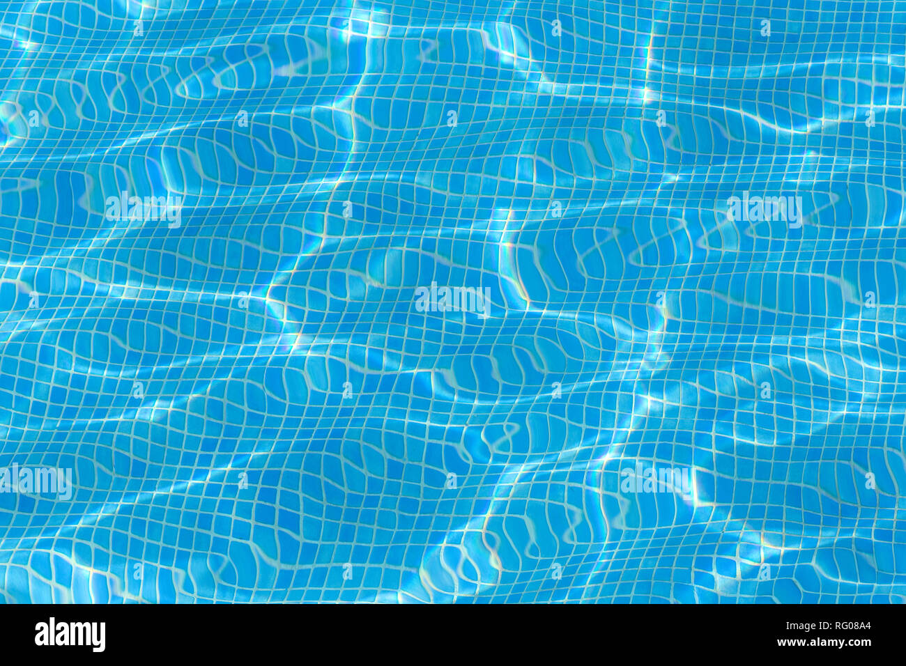 Ripple Water in swimming pool with sun reflection Stock Photo - Alamy