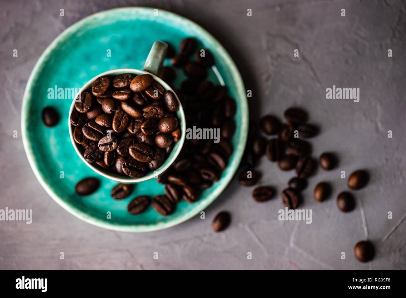 Rustic ceramic cup full of raw coffee beans Stock Photo - Alamy