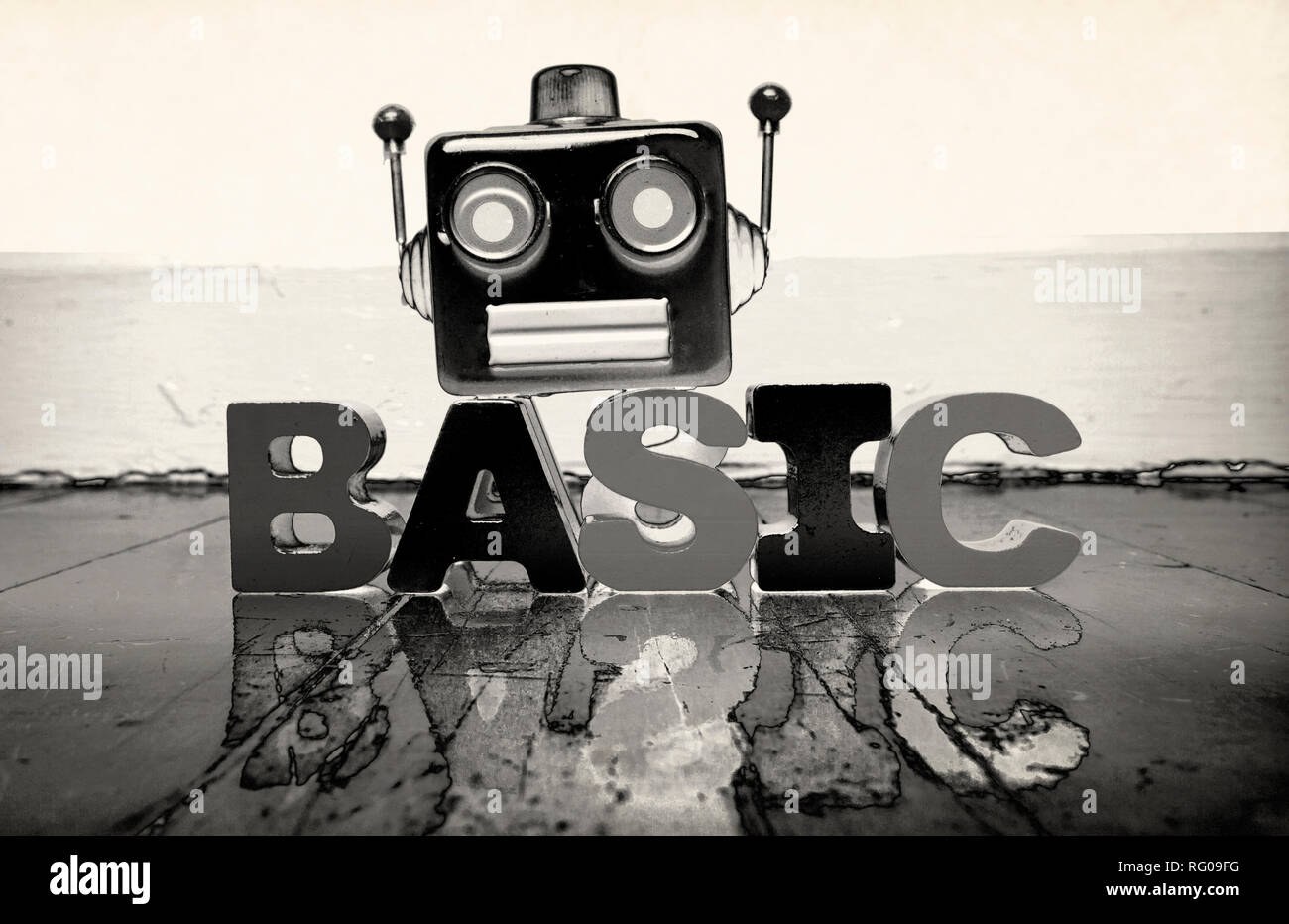 robot head and the word BASIC on a old wooden floor solarized ...