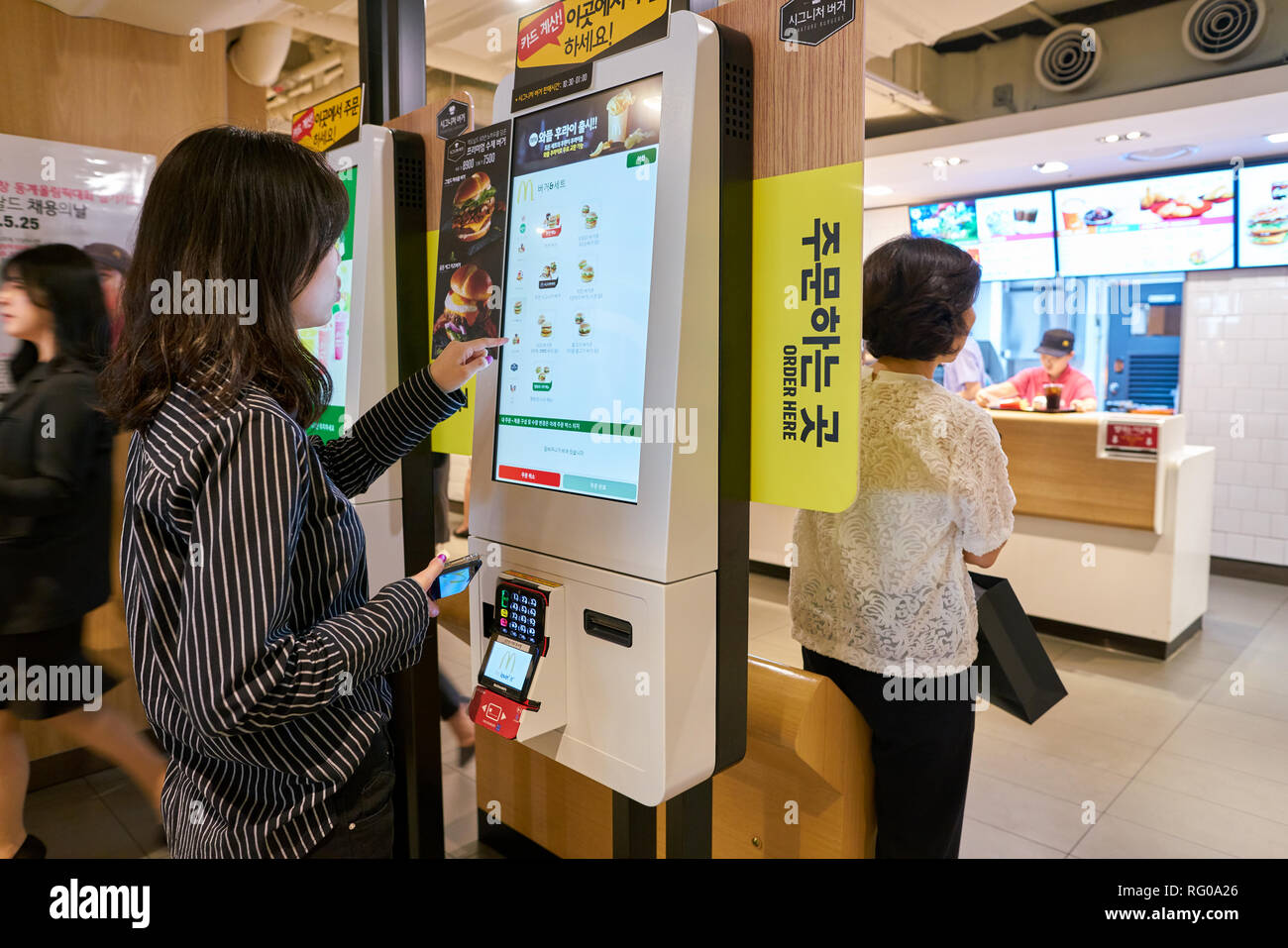 SEOUL, SOUTH KOREA - CIRCA MAY, 2017: woman use McDonald's ordering ...