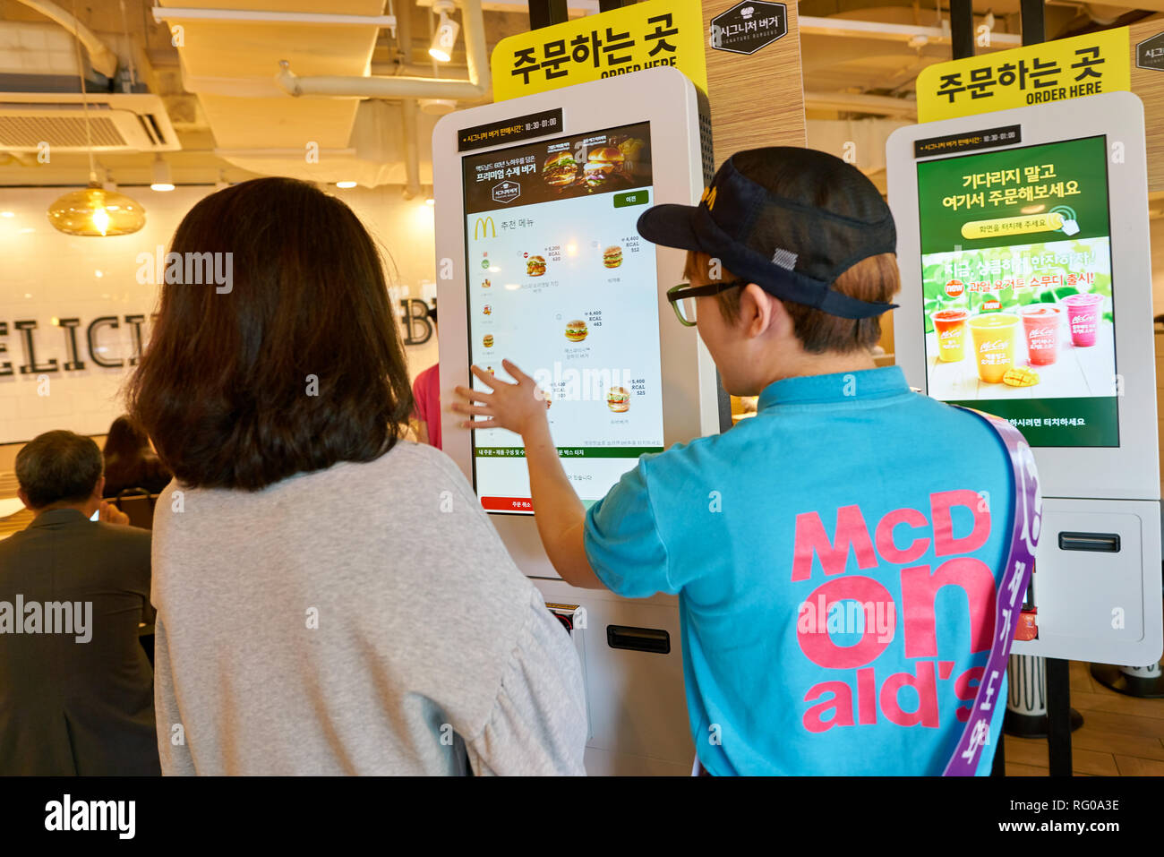 SEOUL, SOUTH KOREA - CIRCA MAY, 2017: people use McDonald's ordering ...