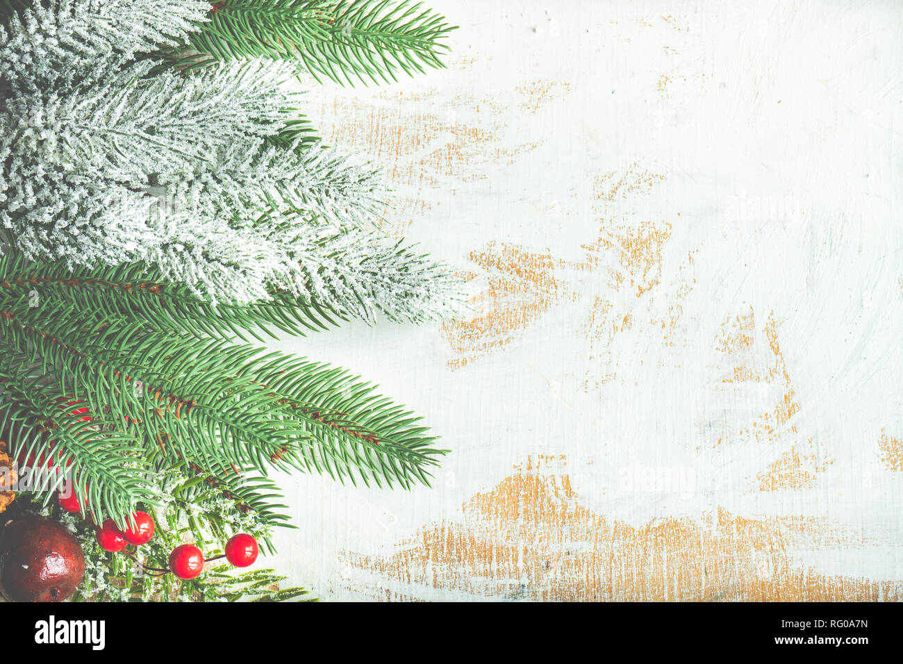 Christmas themed frame with fir tree branches and holiday decoration on ...